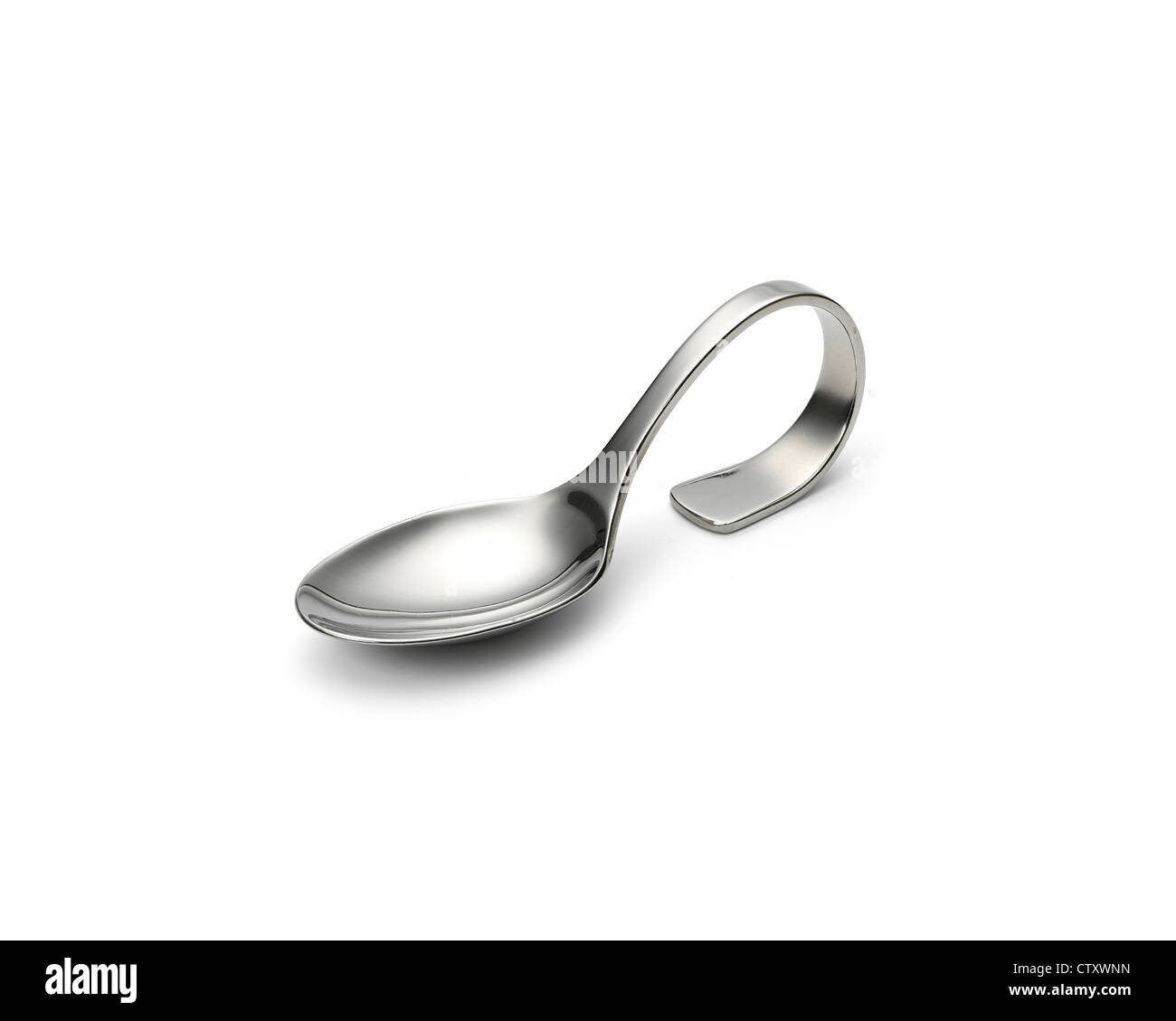 curved chrome spoon on white background Stock Photo - Alamy