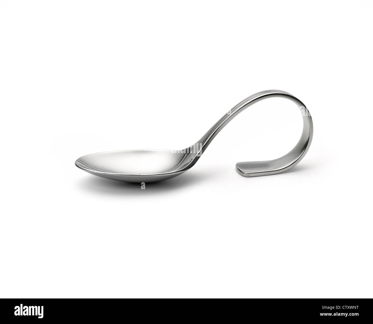 curved chrome spoon on white background Stock Photo - Alamy