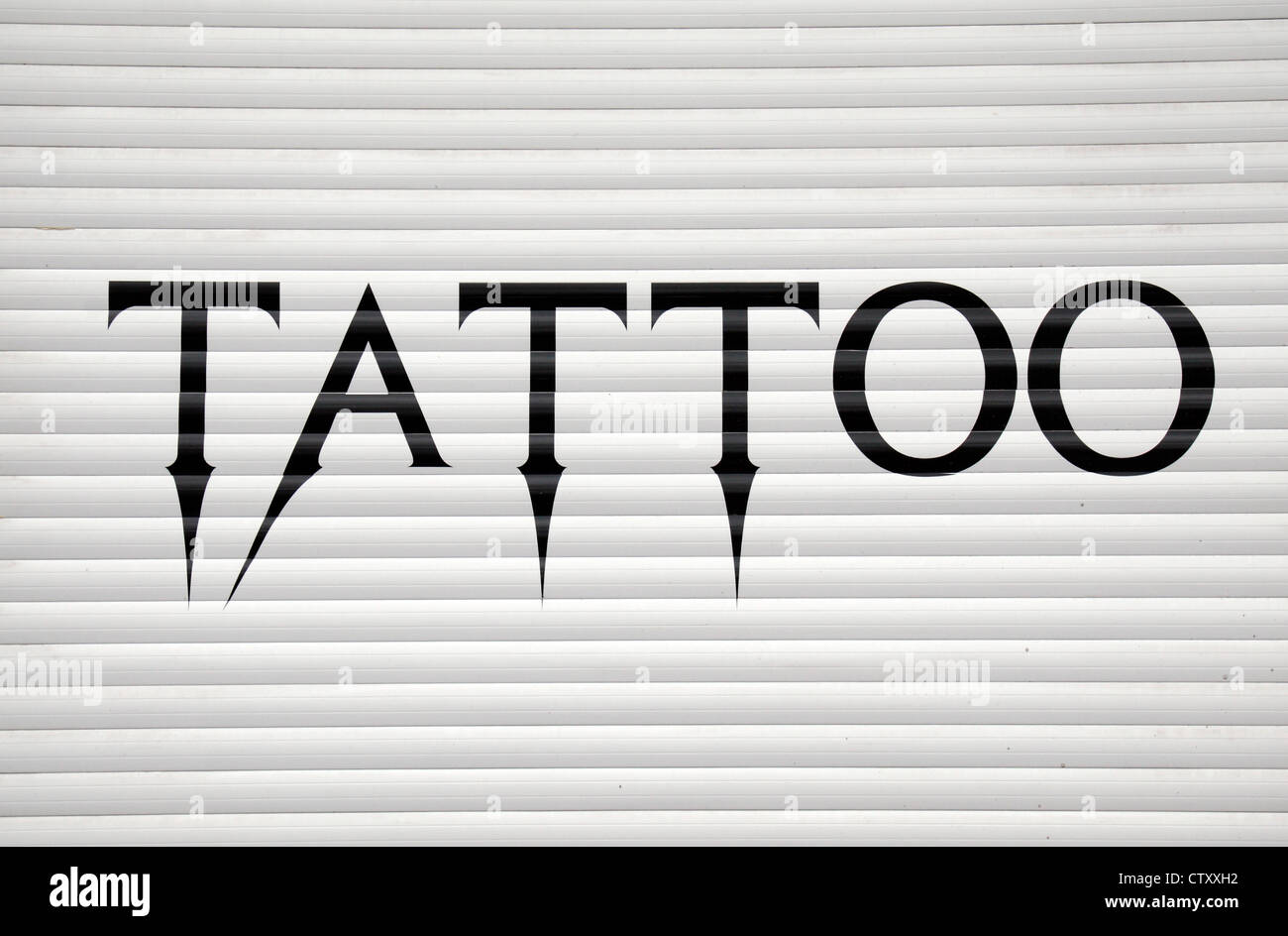 Close up of the word "Tattoo" on a screen outside the "Tattoo" shop in ...