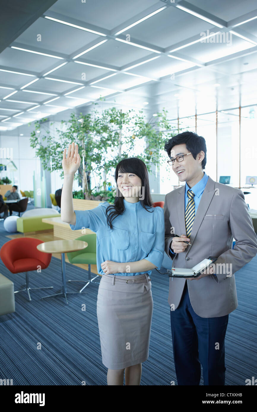 Businessmen saying hello to someone Stock Photo - Alamy