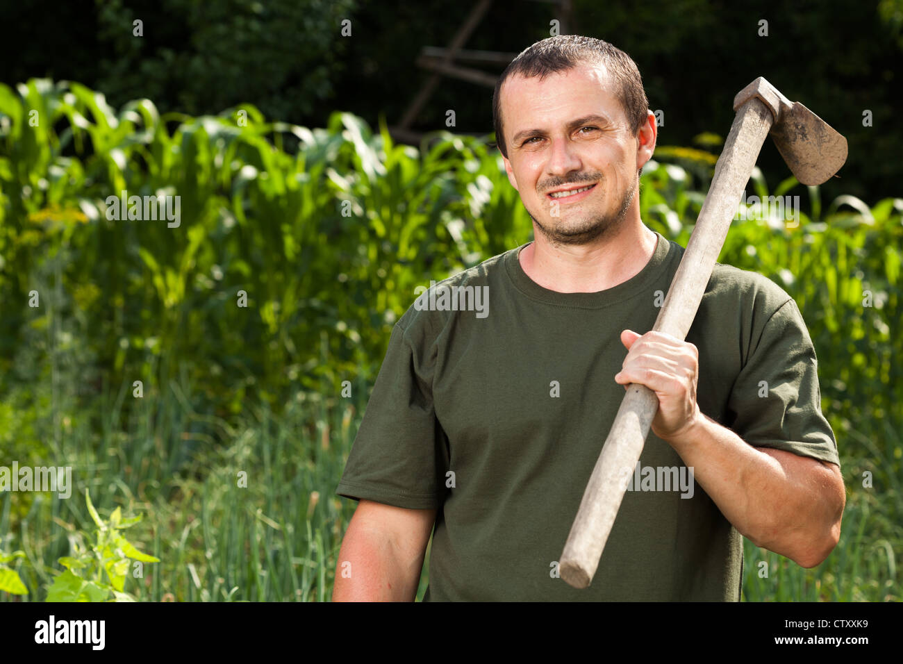 Young sweating farmer after a day of work Stock Photo - Alamy