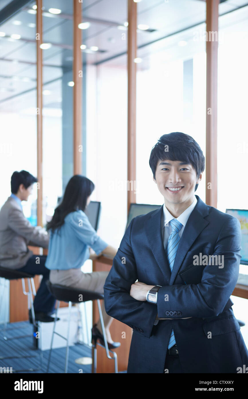 Businessmen using computer in the lounge Stock Photo - Alamy