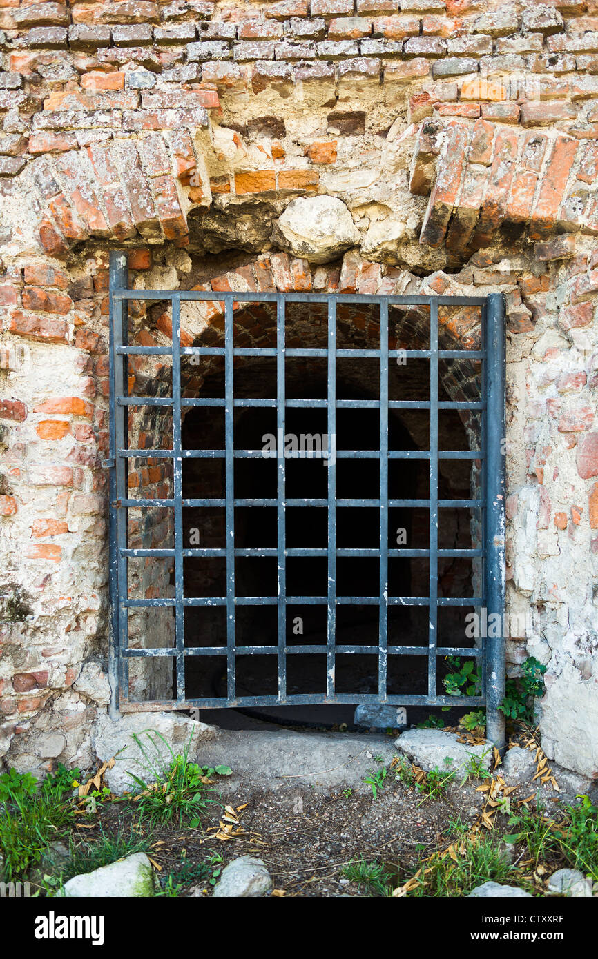 Ancient brick wall with grates Stock Photo - Alamy