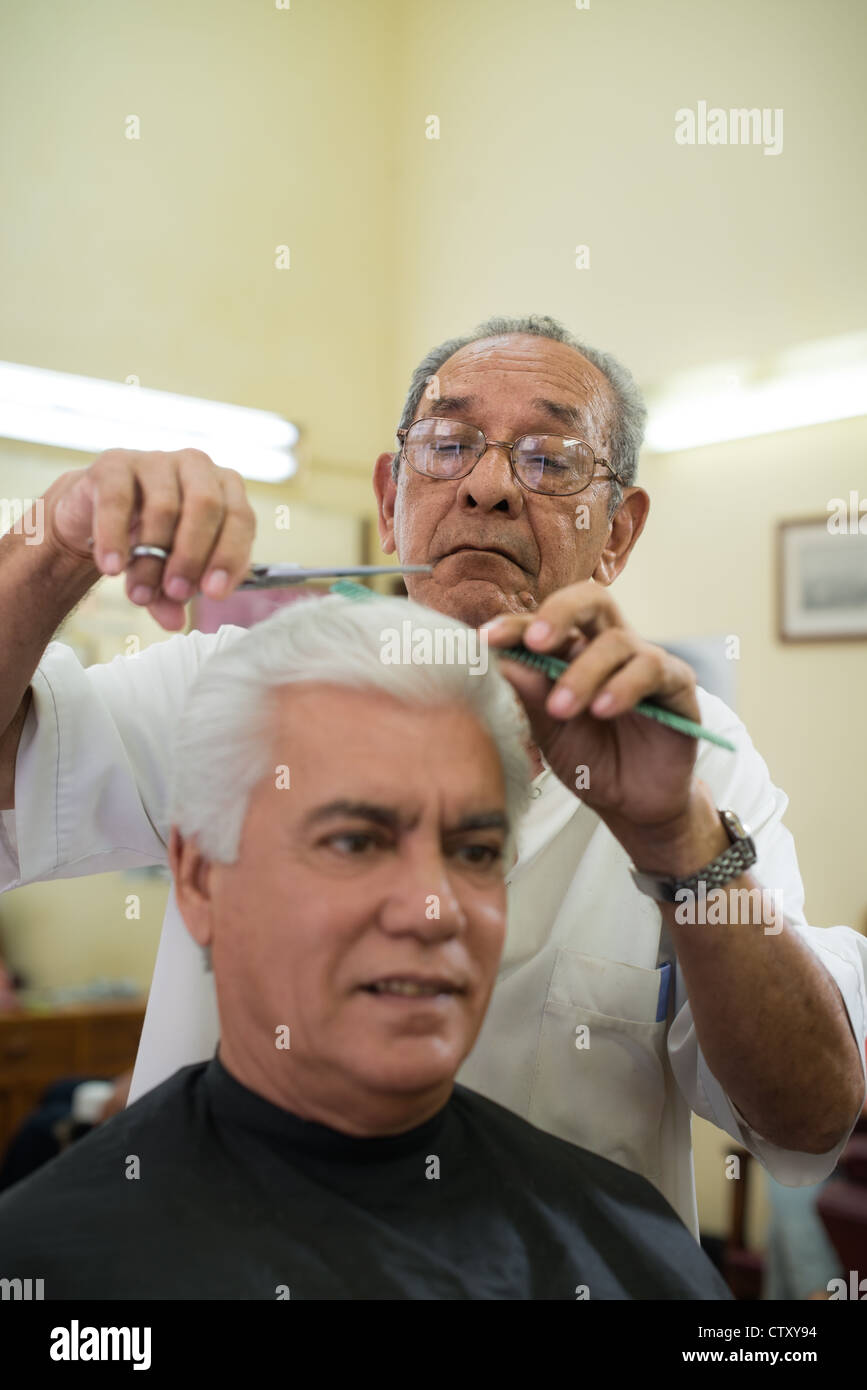 Active retired old people, man getting an haircut by senior barber in ... Active retired old people, man getting an haircut by senior barber in ...