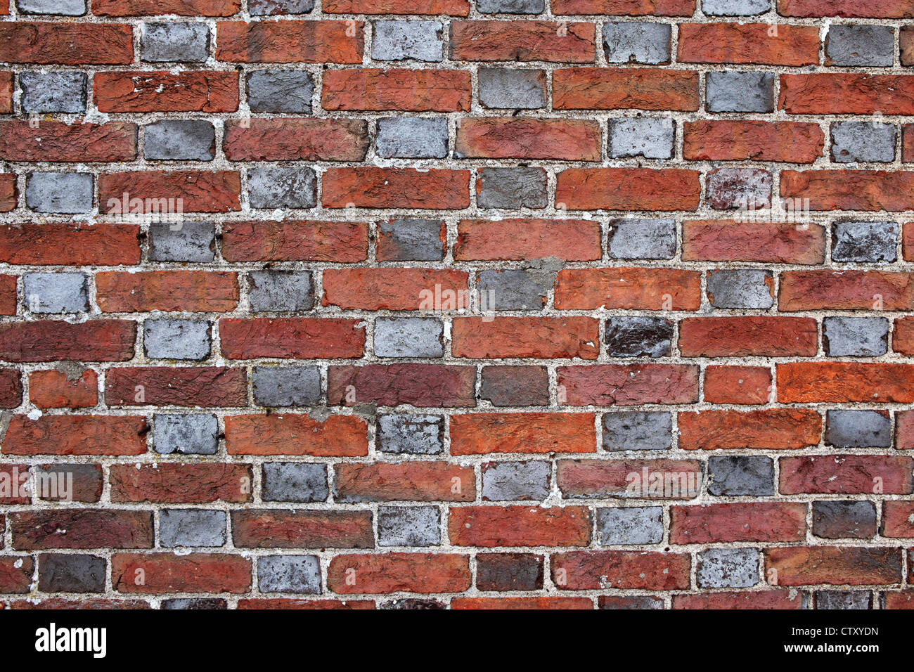 Red and grey bricks are used in the construction of a house in East ...