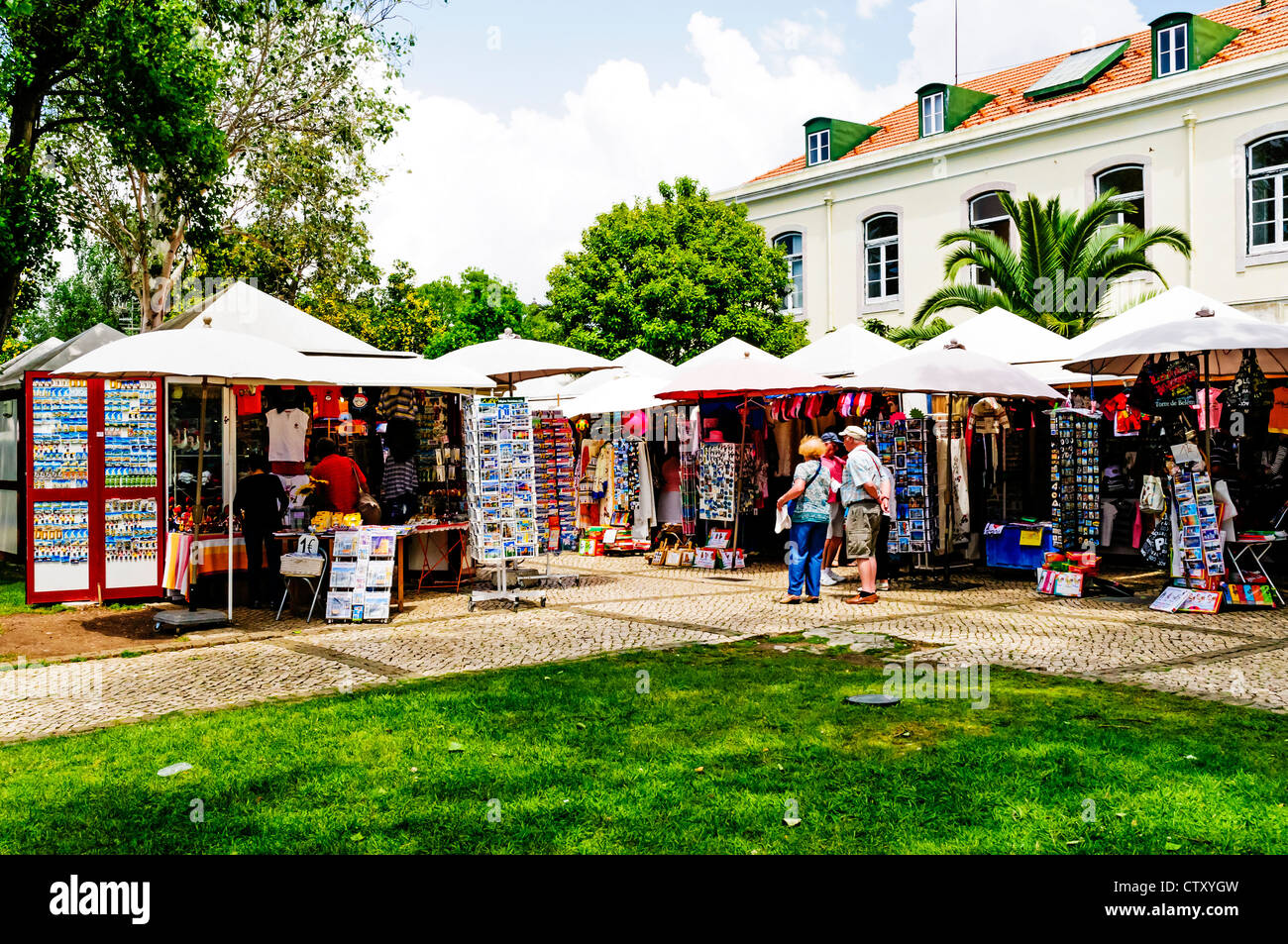 Tourists looking around well stocked and colourful souvenir stalls on a ...