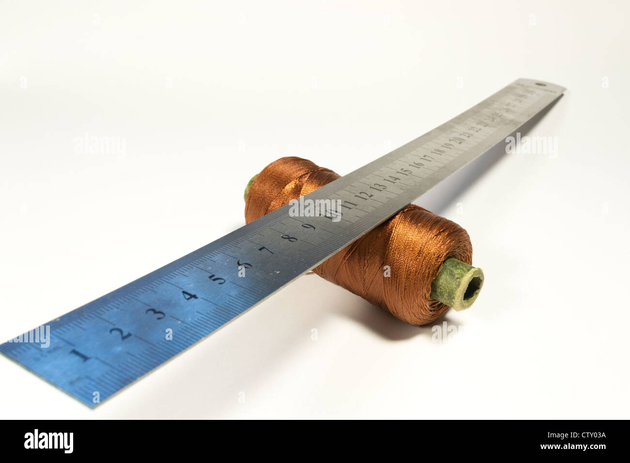 Metal line is riding on the coil Stock Photo - Alamy