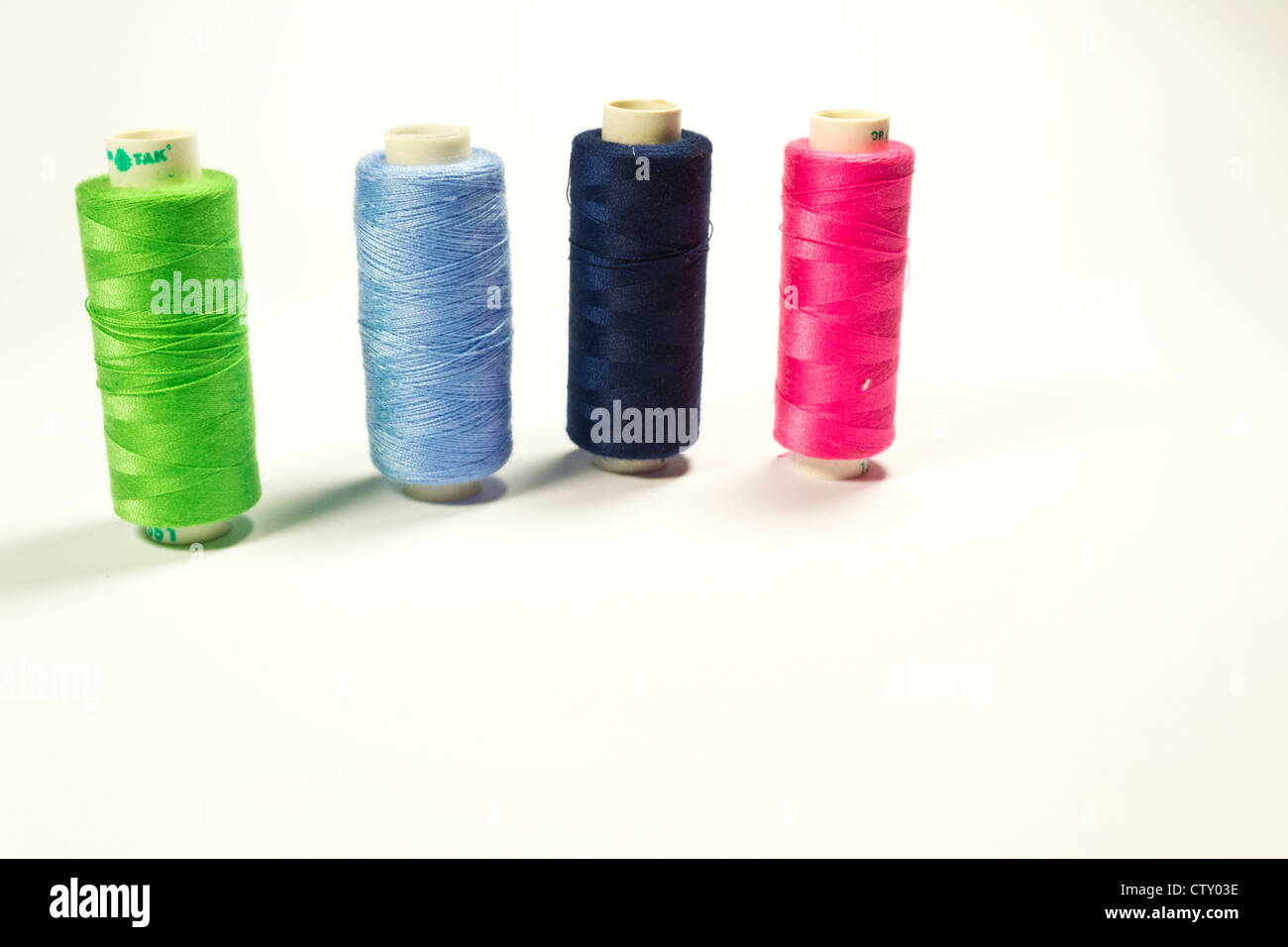 colored thread on a white sheet of paper Stock Photo - Alamy