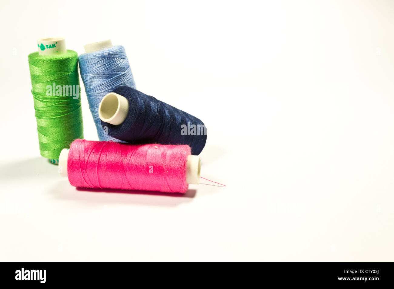 colored thread on a white sheet of paper Stock Photo - Alamy