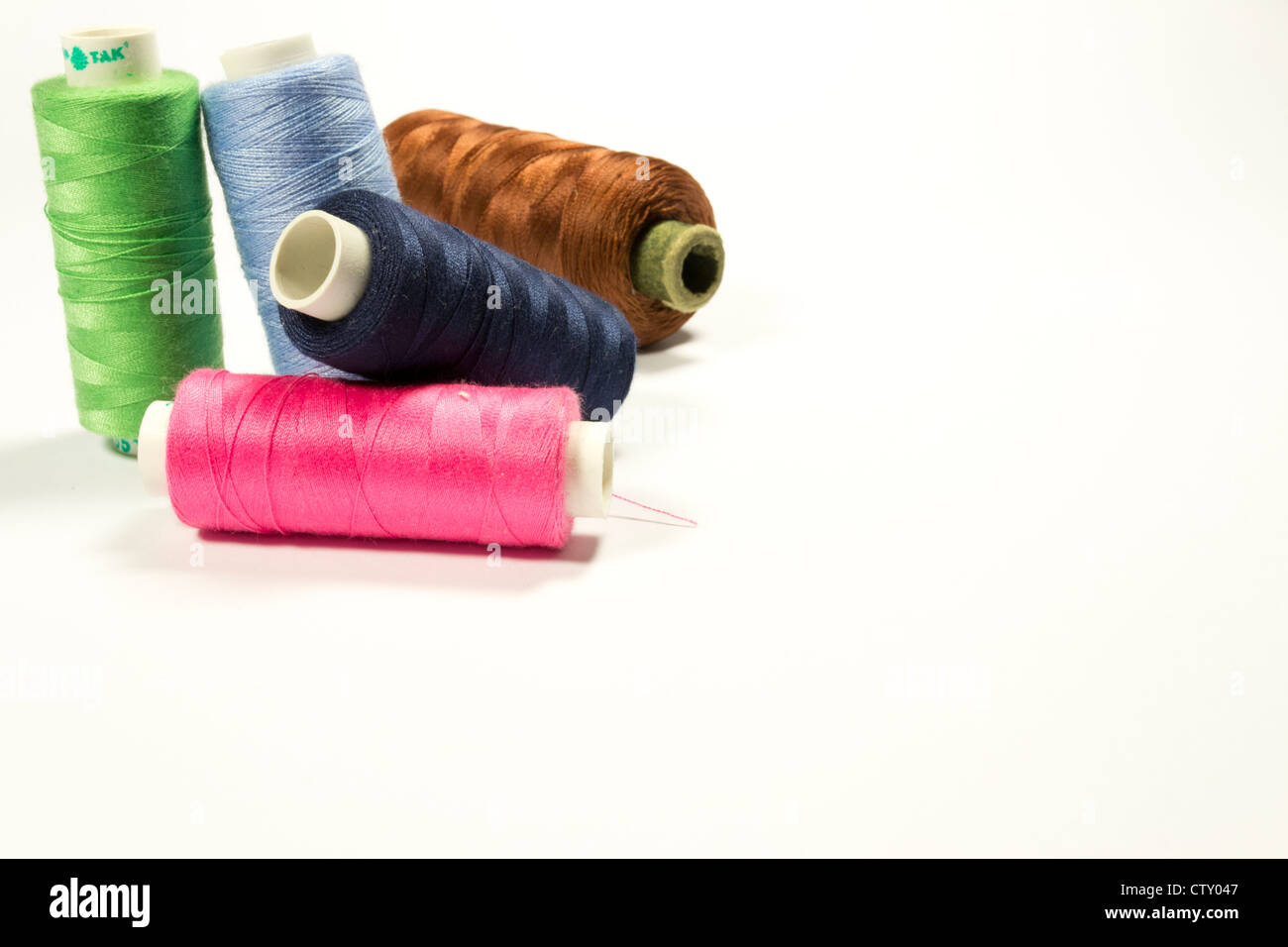 colored thread on a white sheet of paper Stock Photo - Alamy