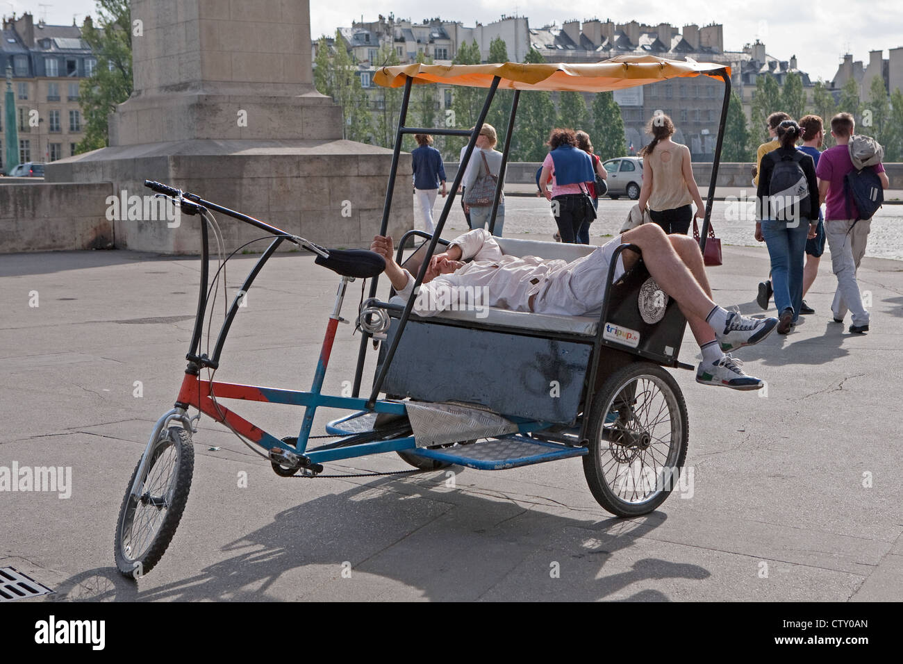 A Rickshaw near the Seine and the Louvre in Paris France Stock Photo ...