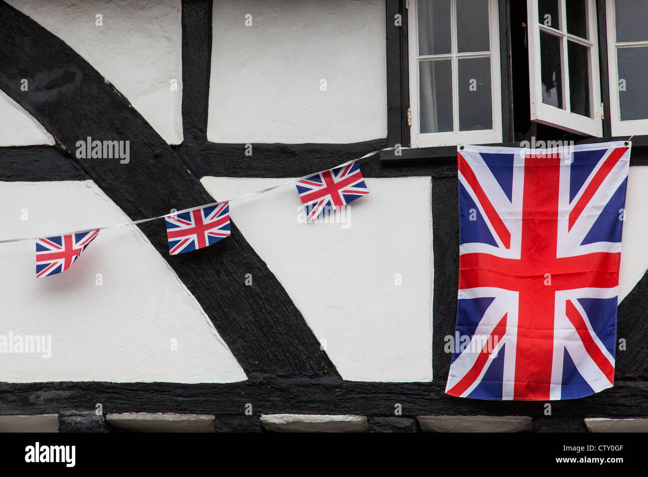 String of Union flags decorate a building as part of the Queen's ...