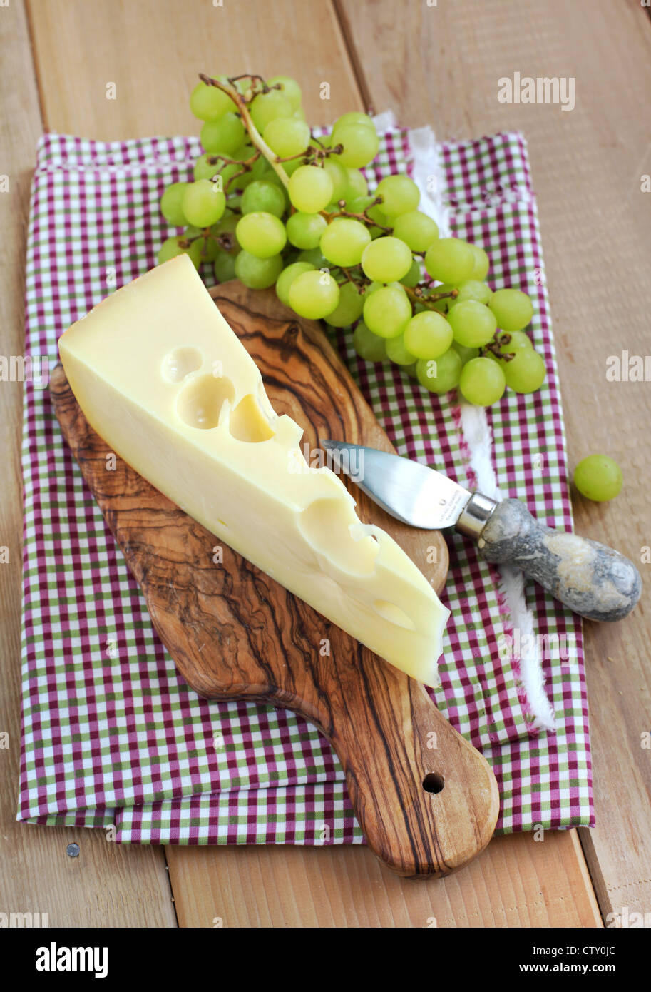 Cheese and grape on the wooden board Stock Photo - Alamy