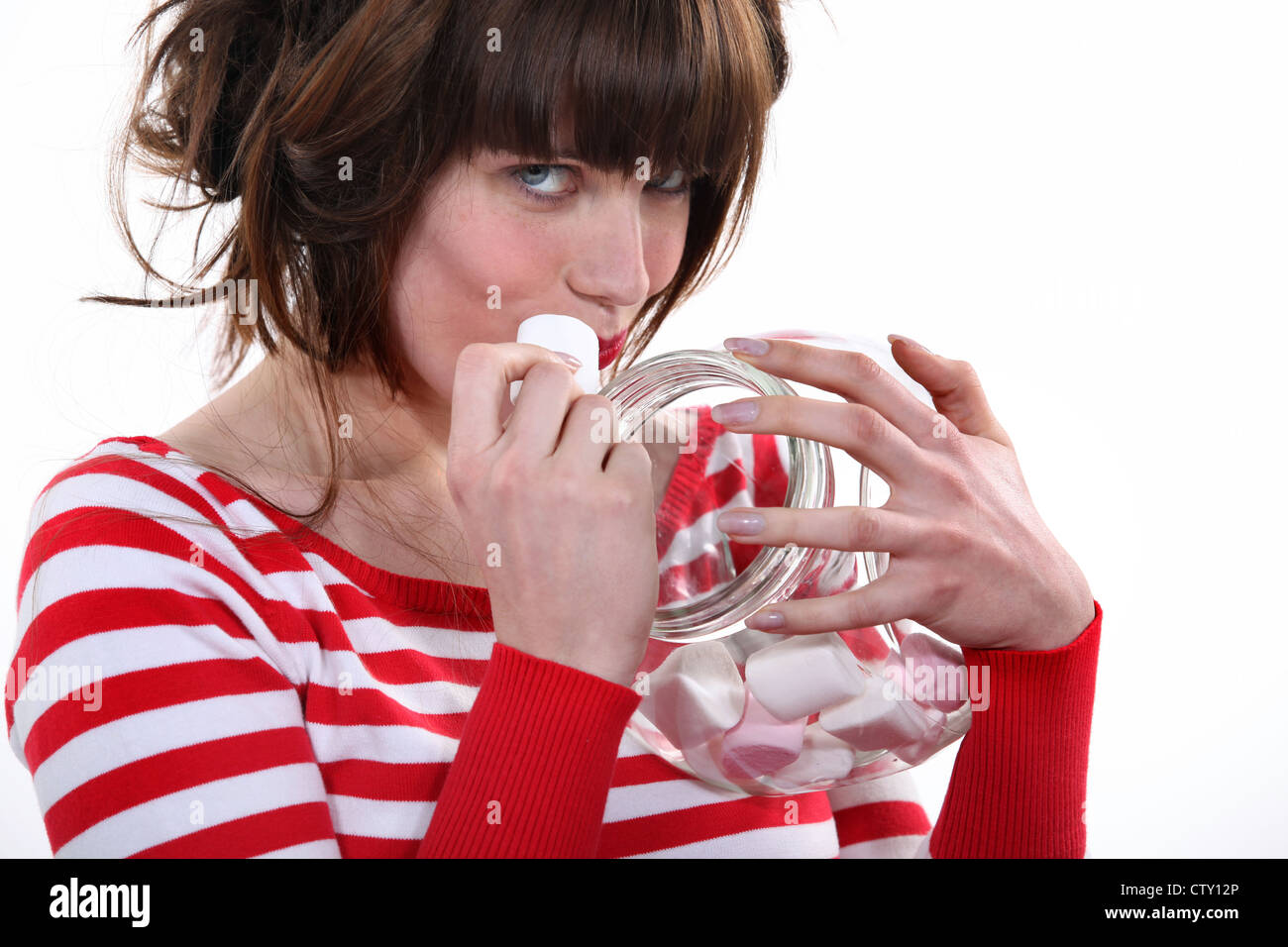 Woman eating marshmallow Stock Photo - Alamy