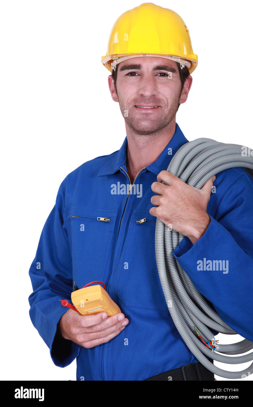Electrician with voltmeter in hand Stock Photo - Alamy