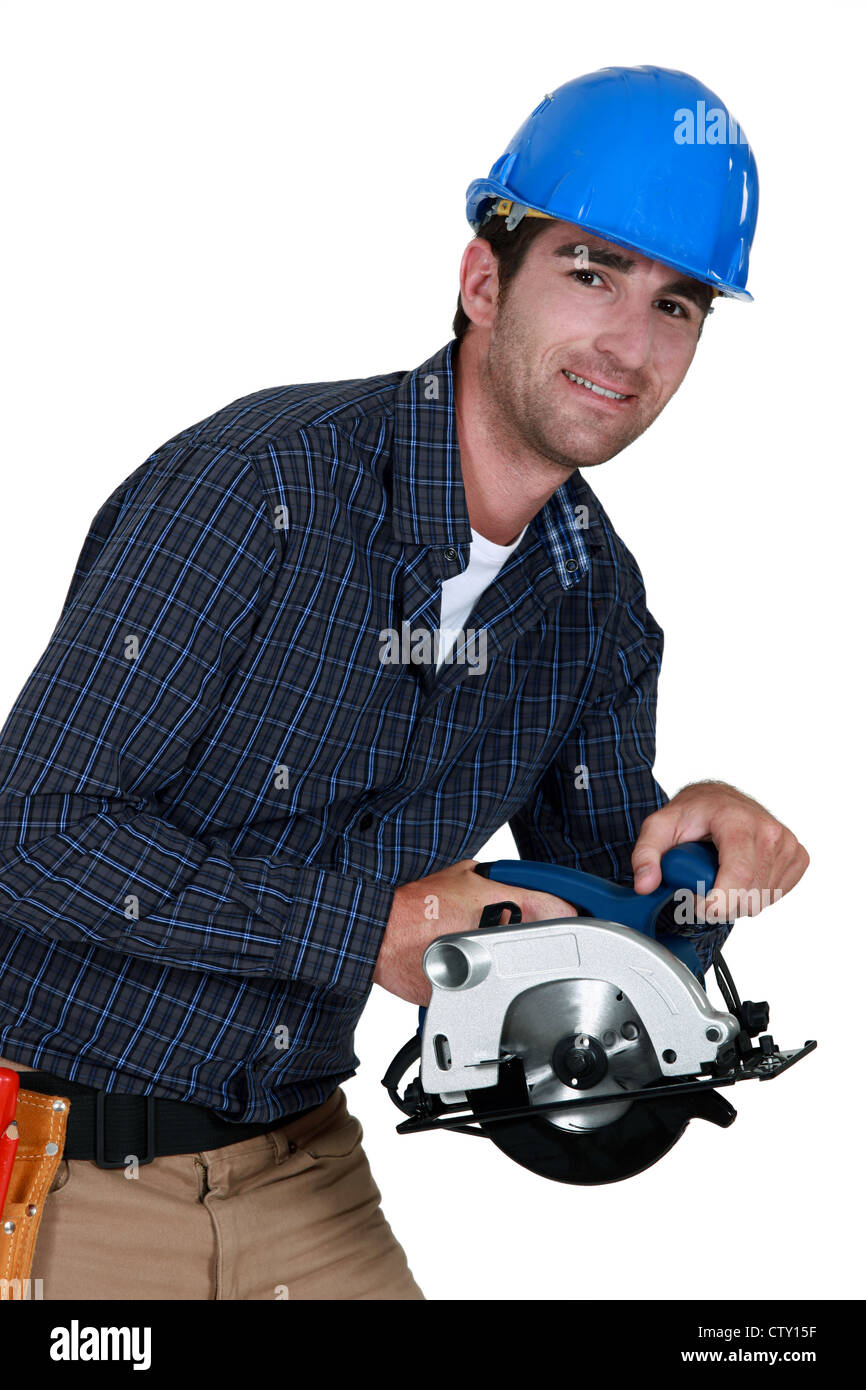 A construction worker with a circular saw Stock Photo - Alamy