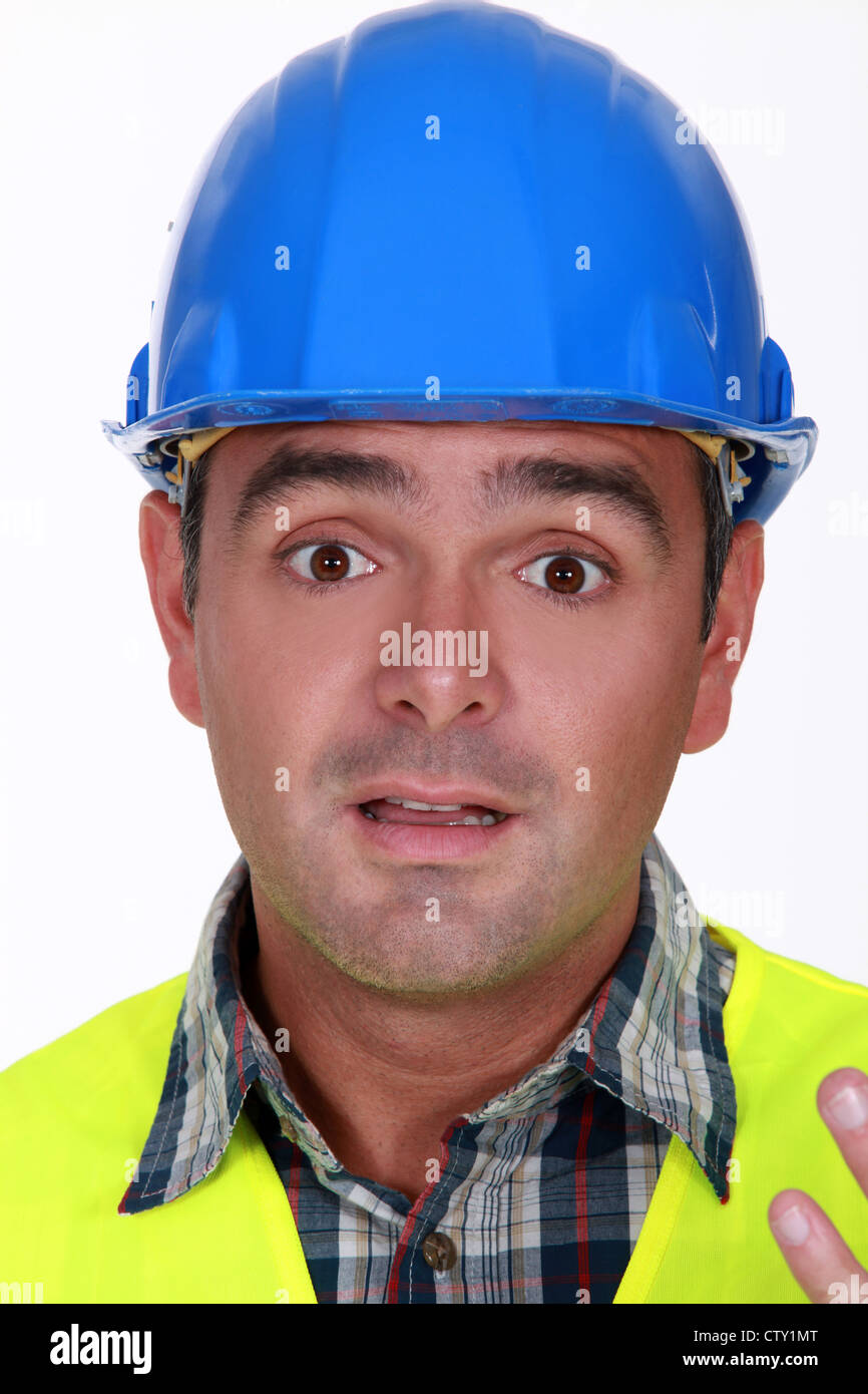 Builder with confused look on his face Stock Photo - Alamy