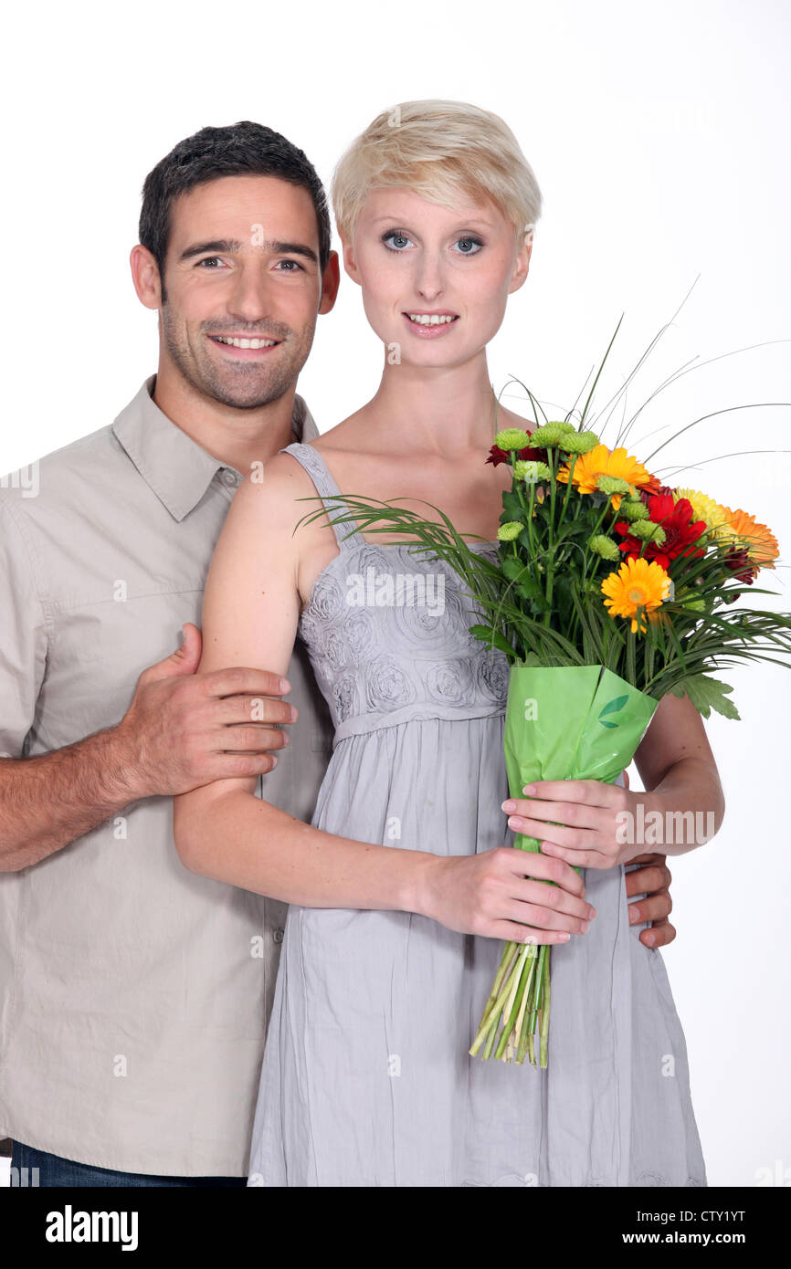 Couple with flowers Stock Photo - Alamy