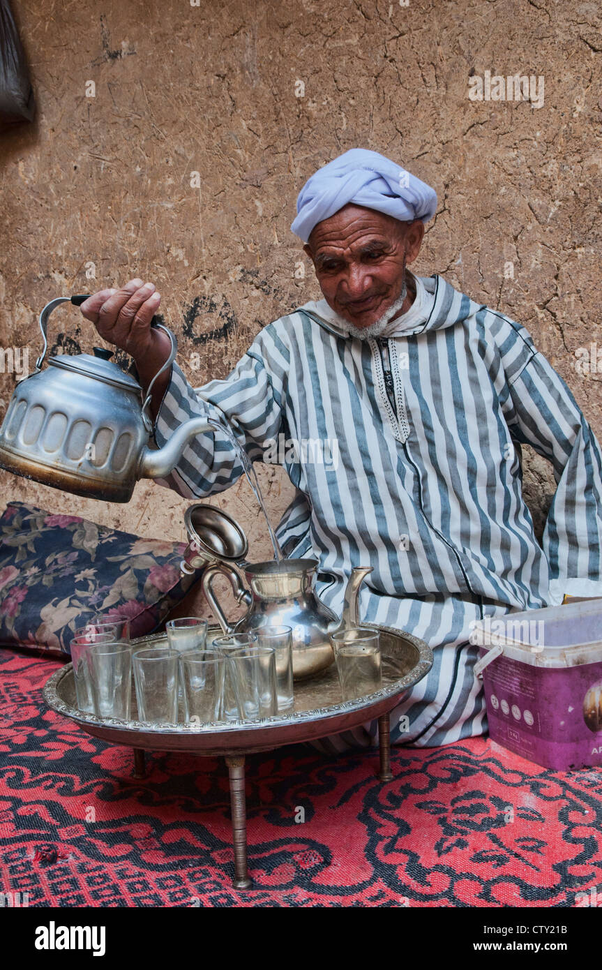 traditional Berber grandfather pouring tea in the Southern Atlas ...