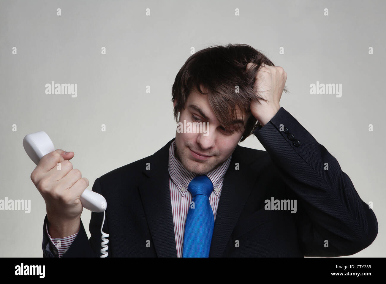 Office worker scratching head hi-res stock photography and images - Alamy