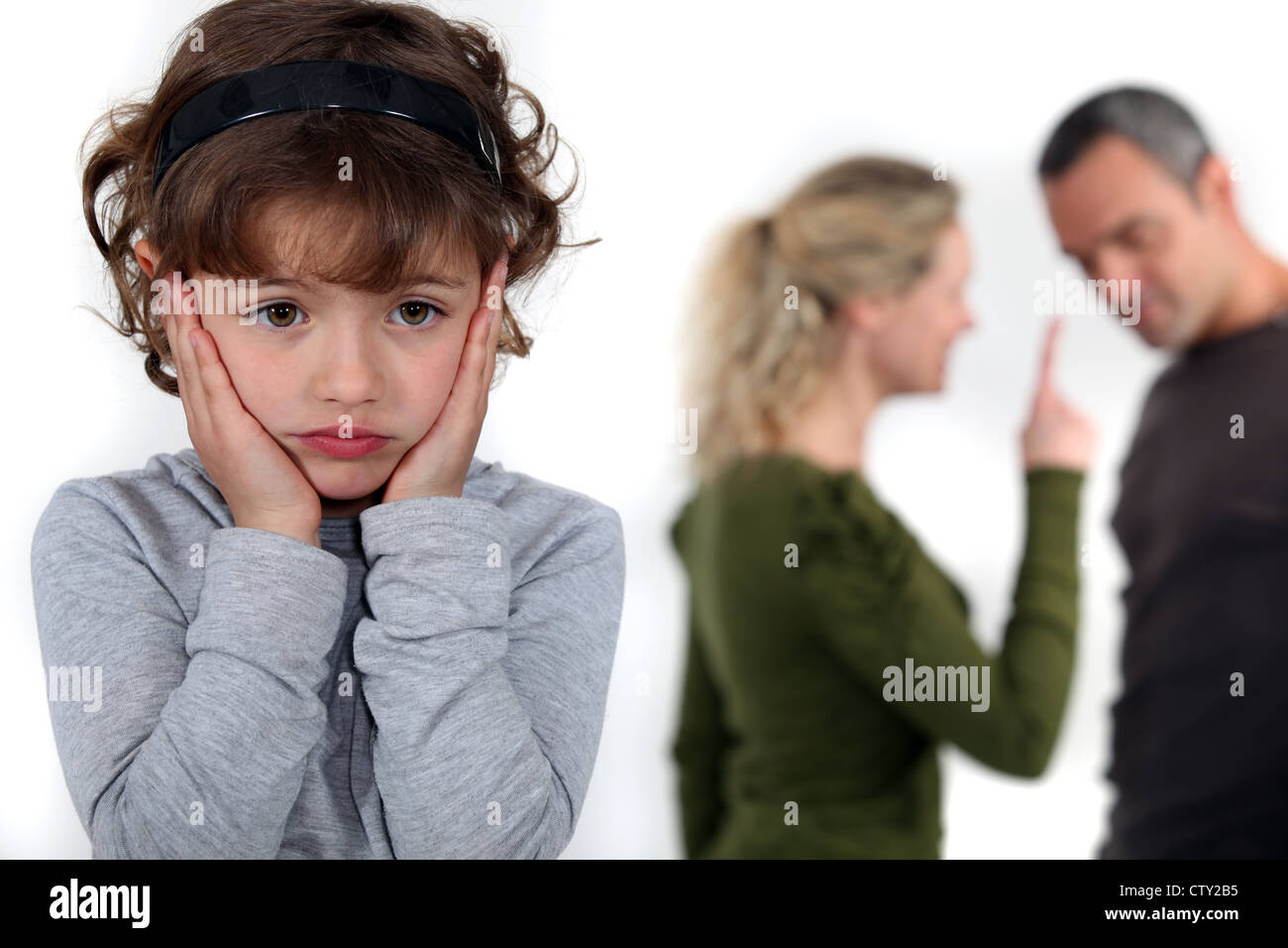 Little girl upset by parents arguing Stock Photo - Alamy