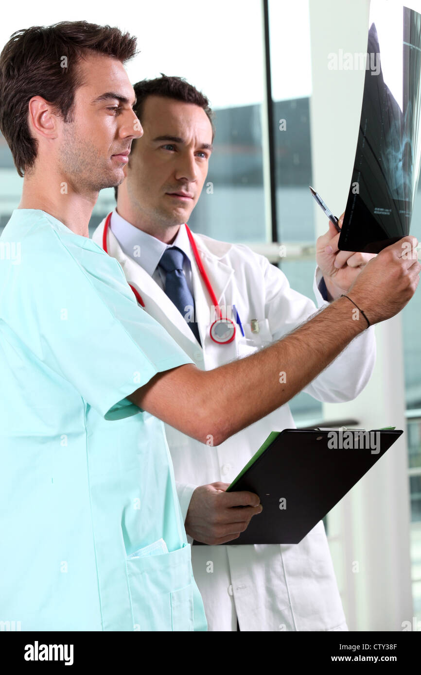 Two doctors examining x-ray image Stock Photo - Alamy