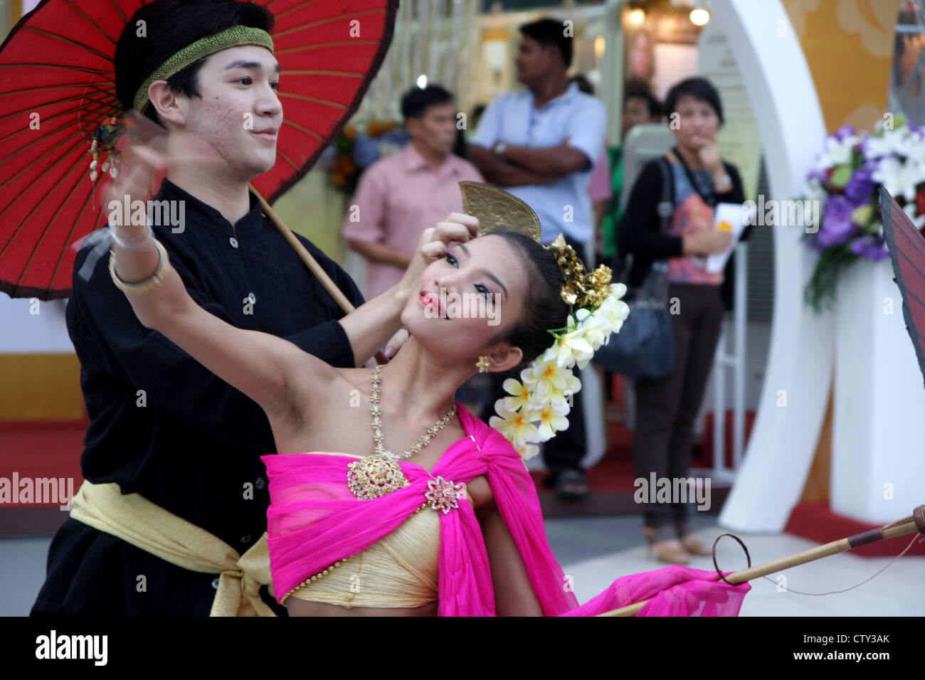 Thai traditional umbrella dancer dancing at Siam Paragon shopping mall ...