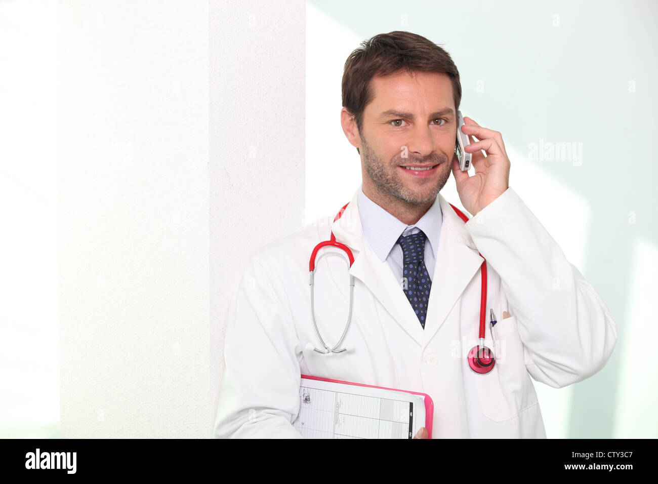 Doctor on the phone Stock Photo - Alamy