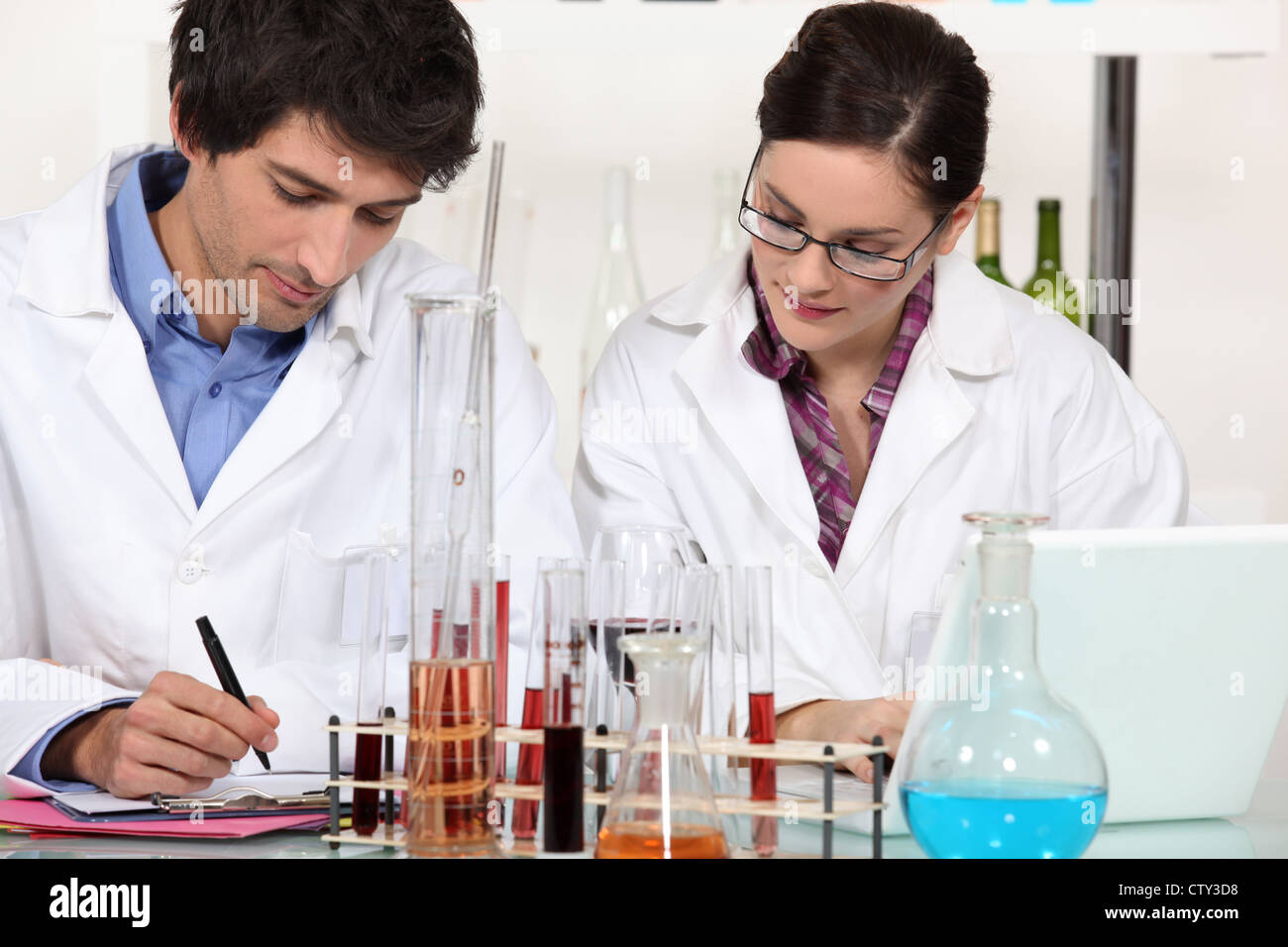 Two scientists in laboratory Stock Photo - Alamy