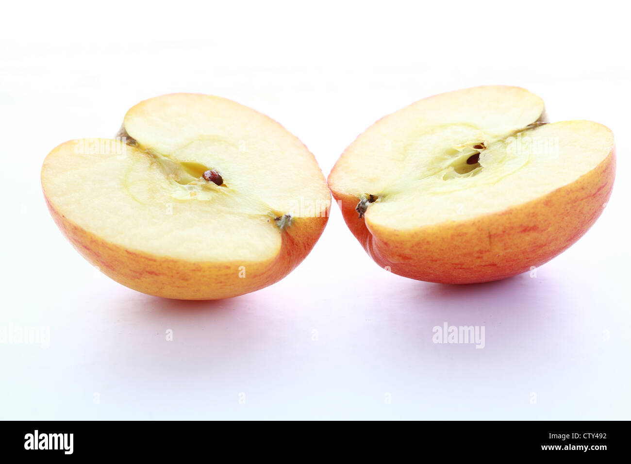 Apple sliced in half Stock Photo - Alamy