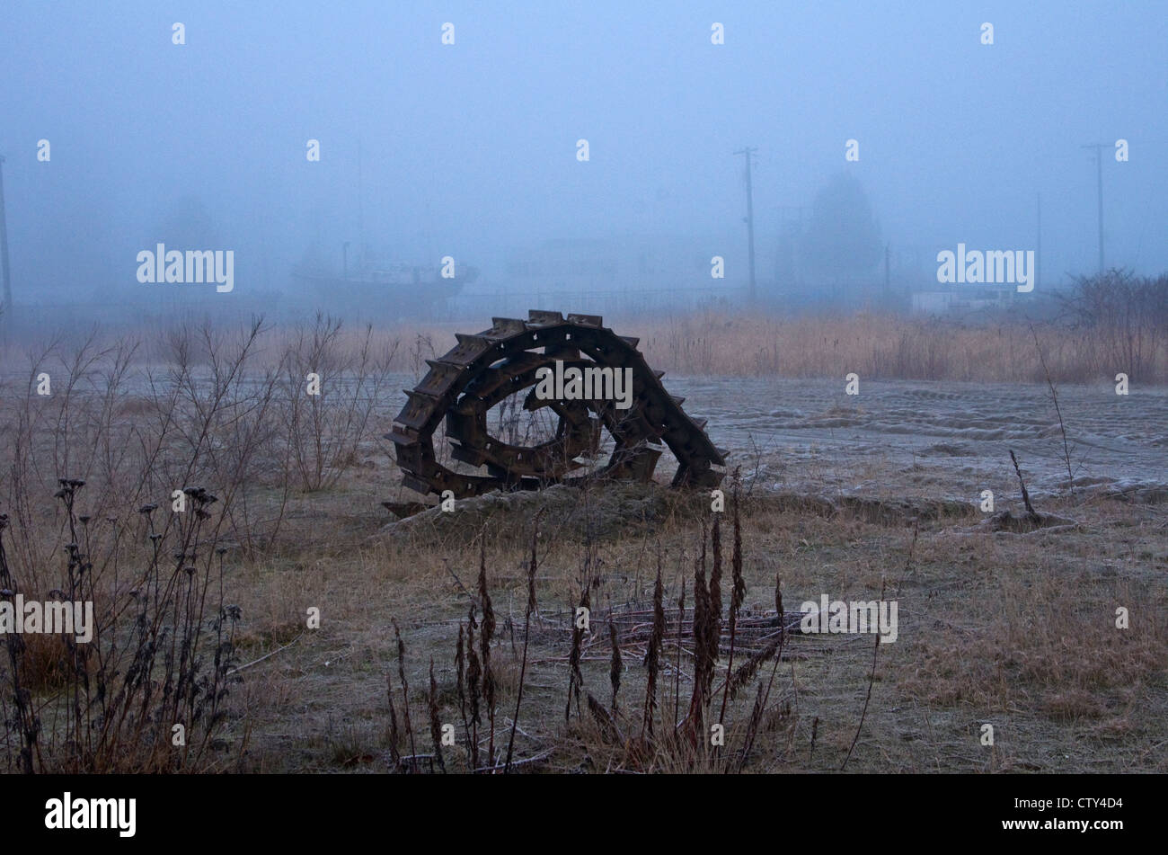 Heavy equipment track with fog in the background Stock Photo - Alamy