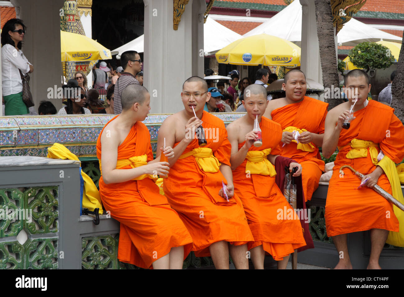 Thai monks drinking water from bottle Stock Photo - Alamy