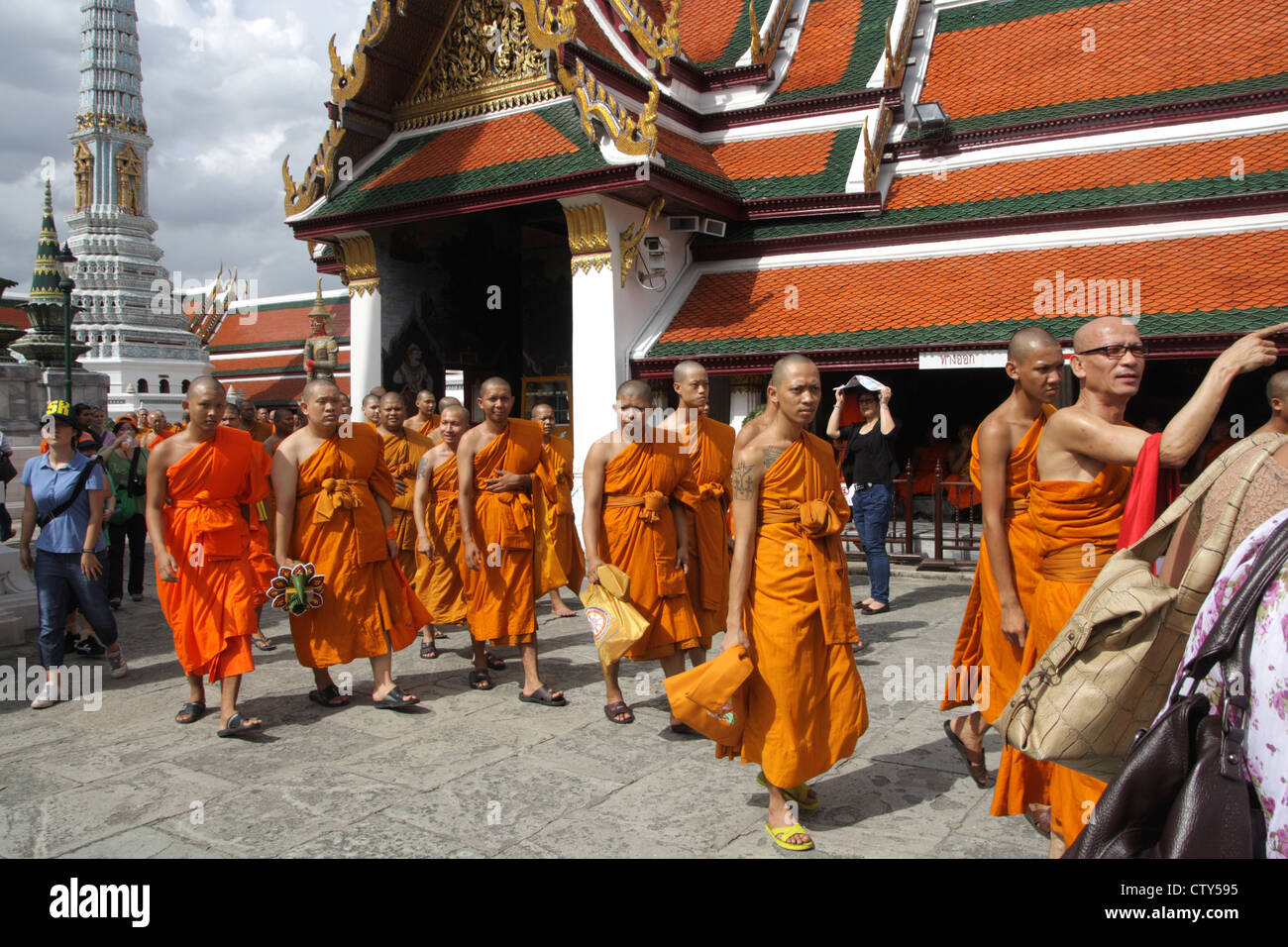 Thai Buddhist Monks walking inside The Grand Palace Temple in Bangkok ...