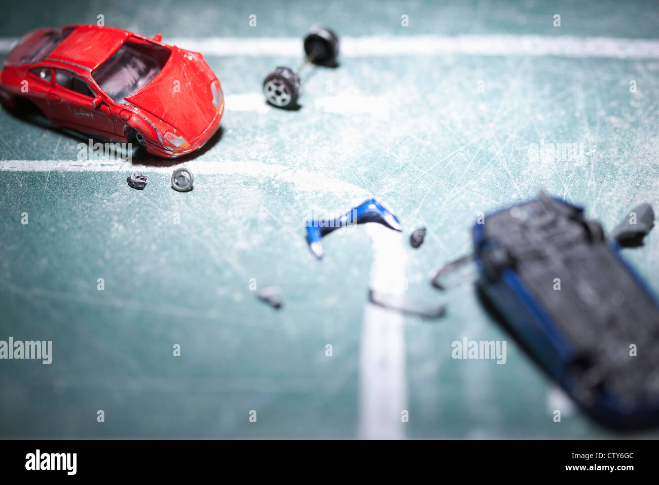 Broken red and blue car on the road Stock Photo - Alamy
