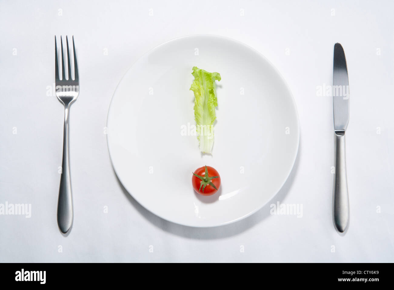 Lettuce and cherry tomato in the exclamation shape Stock Photo - Alamy