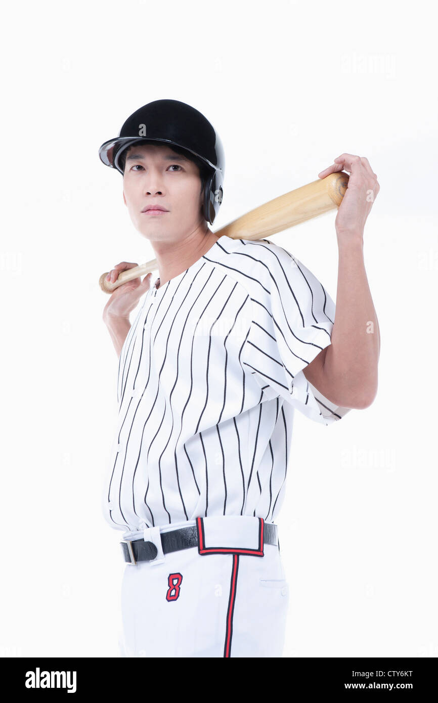 A baseball player putting the bat on his back Stock Photo - Alamy