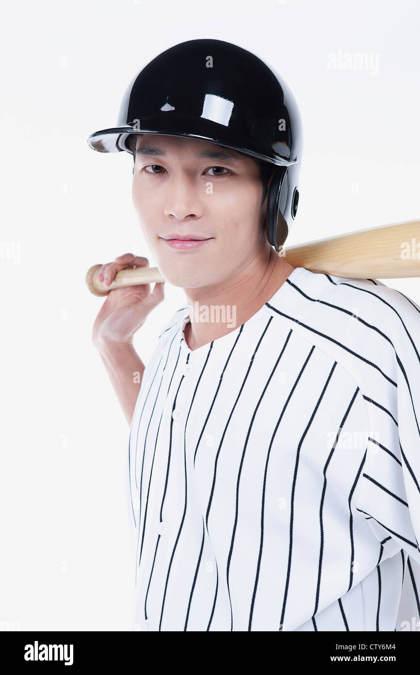 A baseball player putting the bat on his back Stock Photo - Alamy
