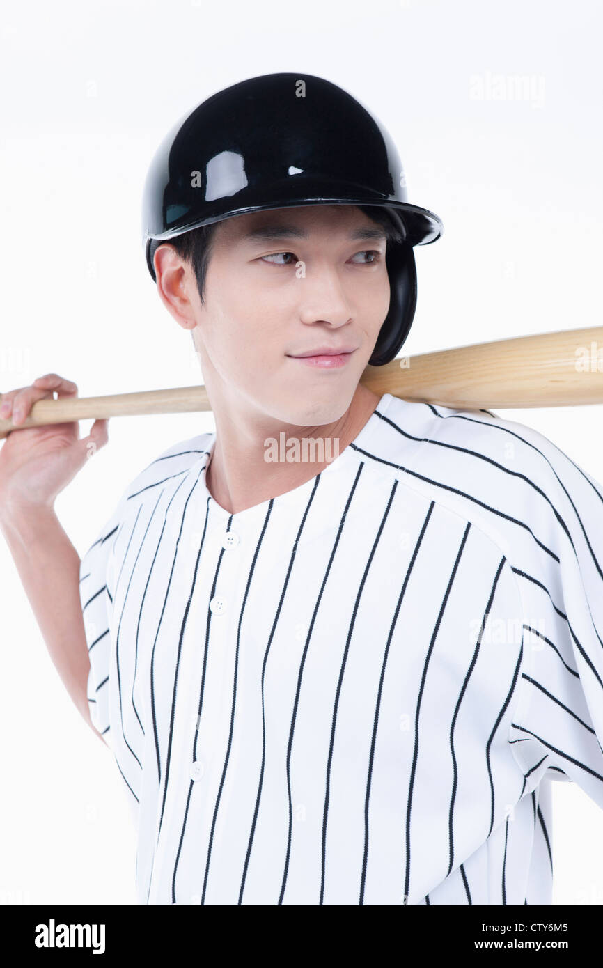 A baseball player putting the bat on his back Stock Photo - Alamy