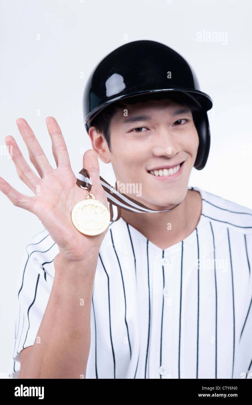 A baseball player with gold medal Stock Photo - Alamy