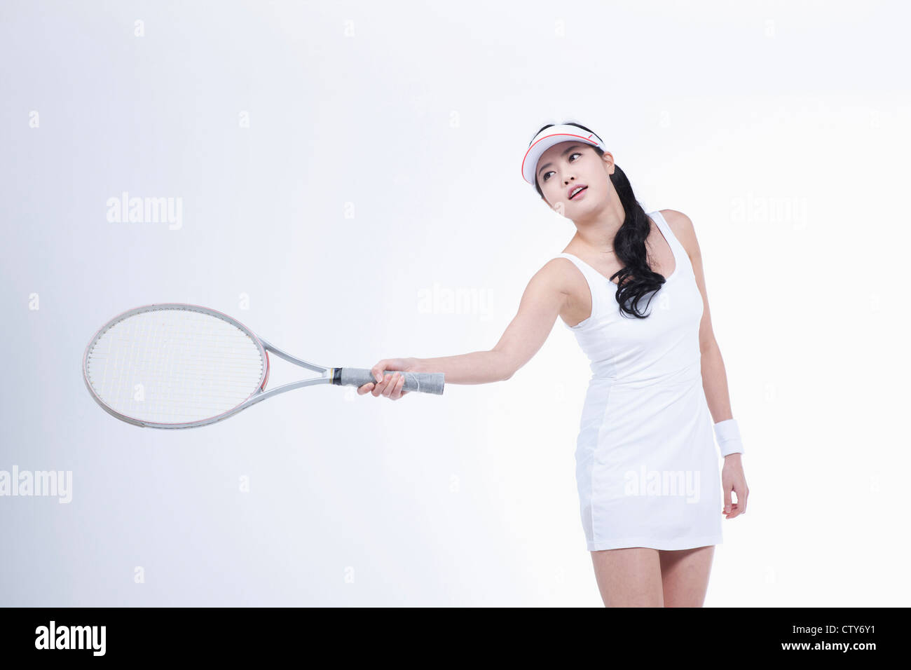 A female tennis player swing a racket Stock Photo - Alamy