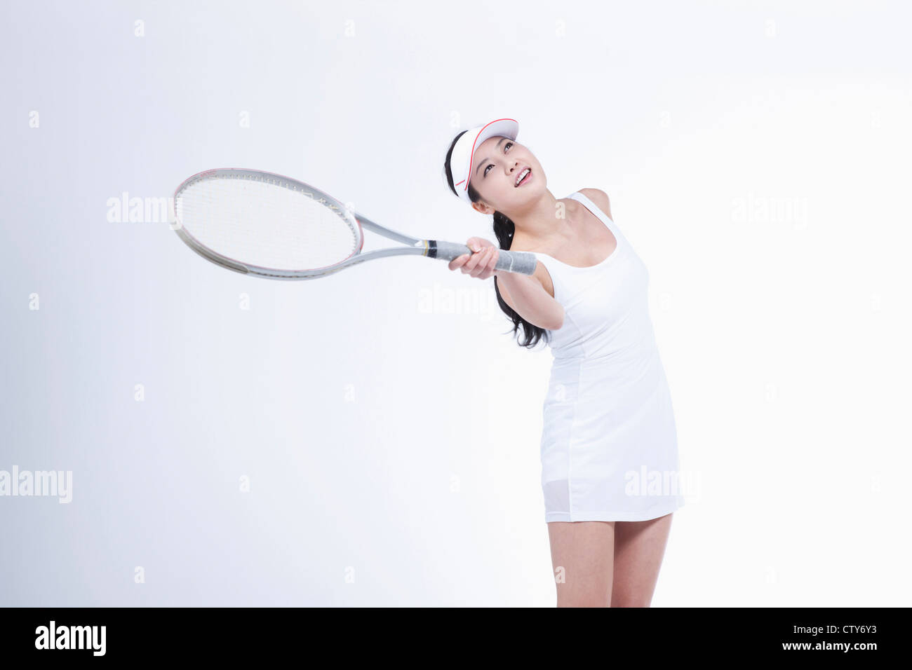 A female tennis player swing a racket Stock Photo - Alamy