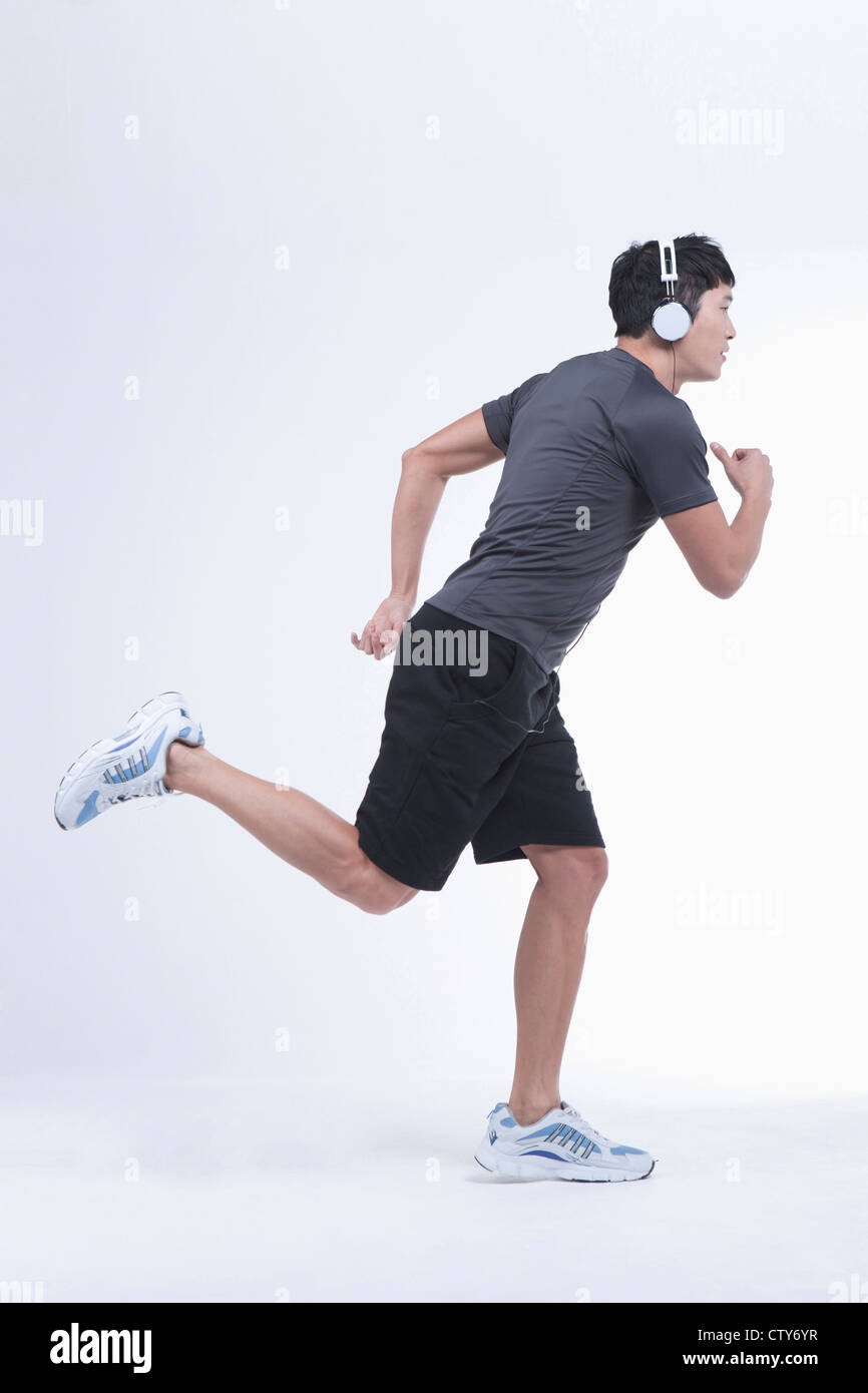 A running man listening to the music Stock Photo - Alamy