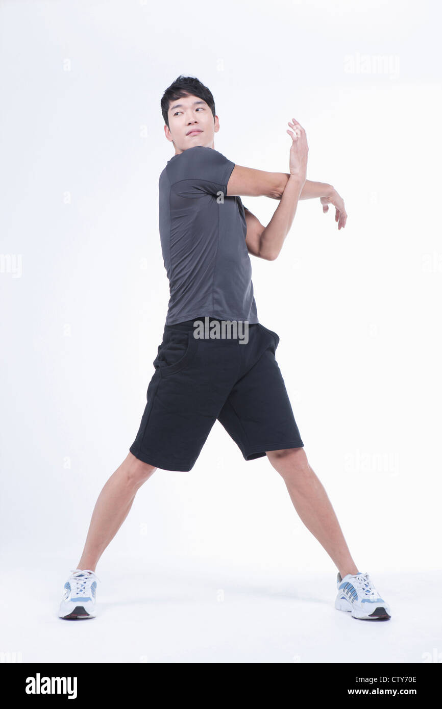 A man stretching his arms Stock Photo - Alamy