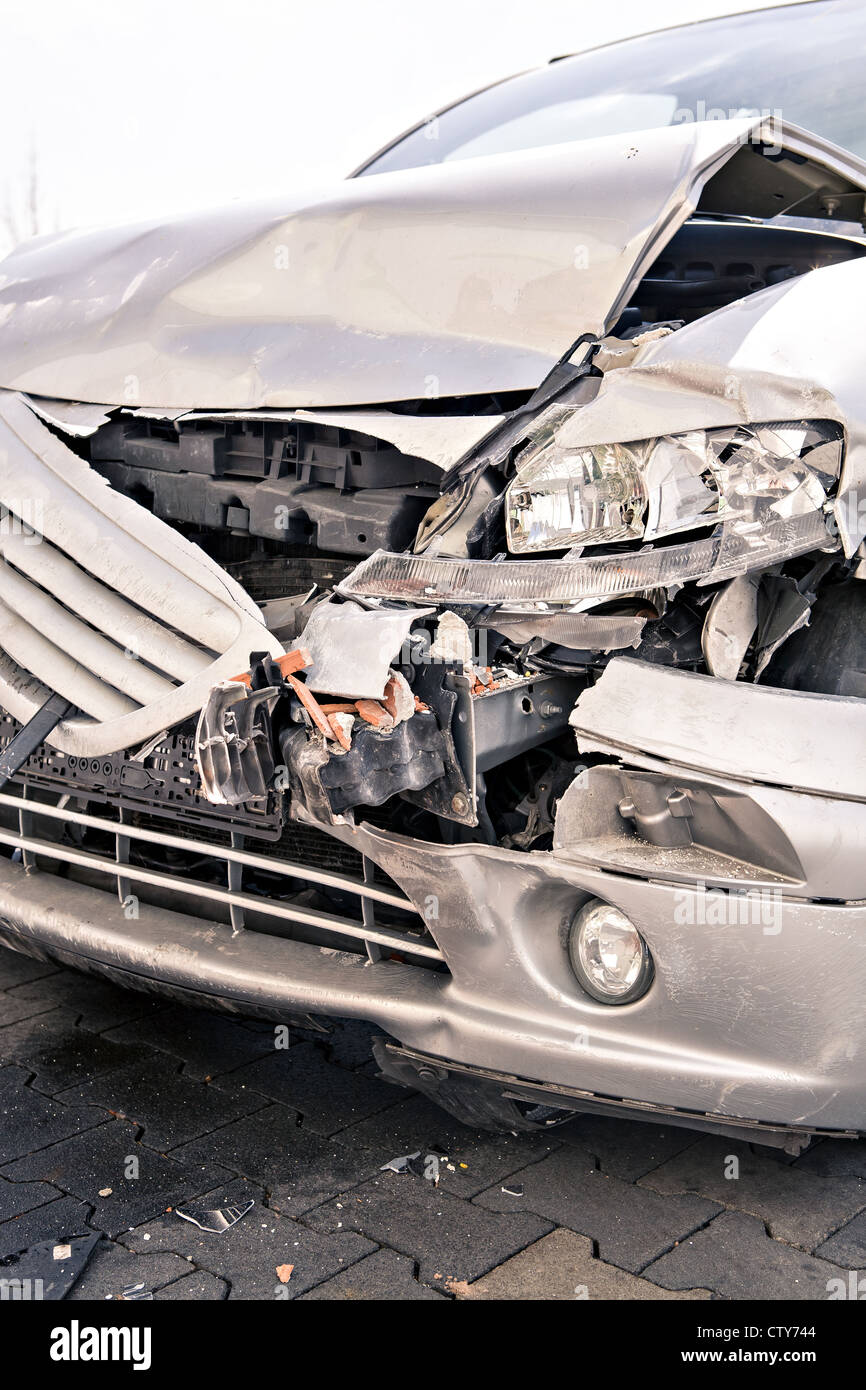 a demolished car after an accident on the street Stock Photo - Alamy