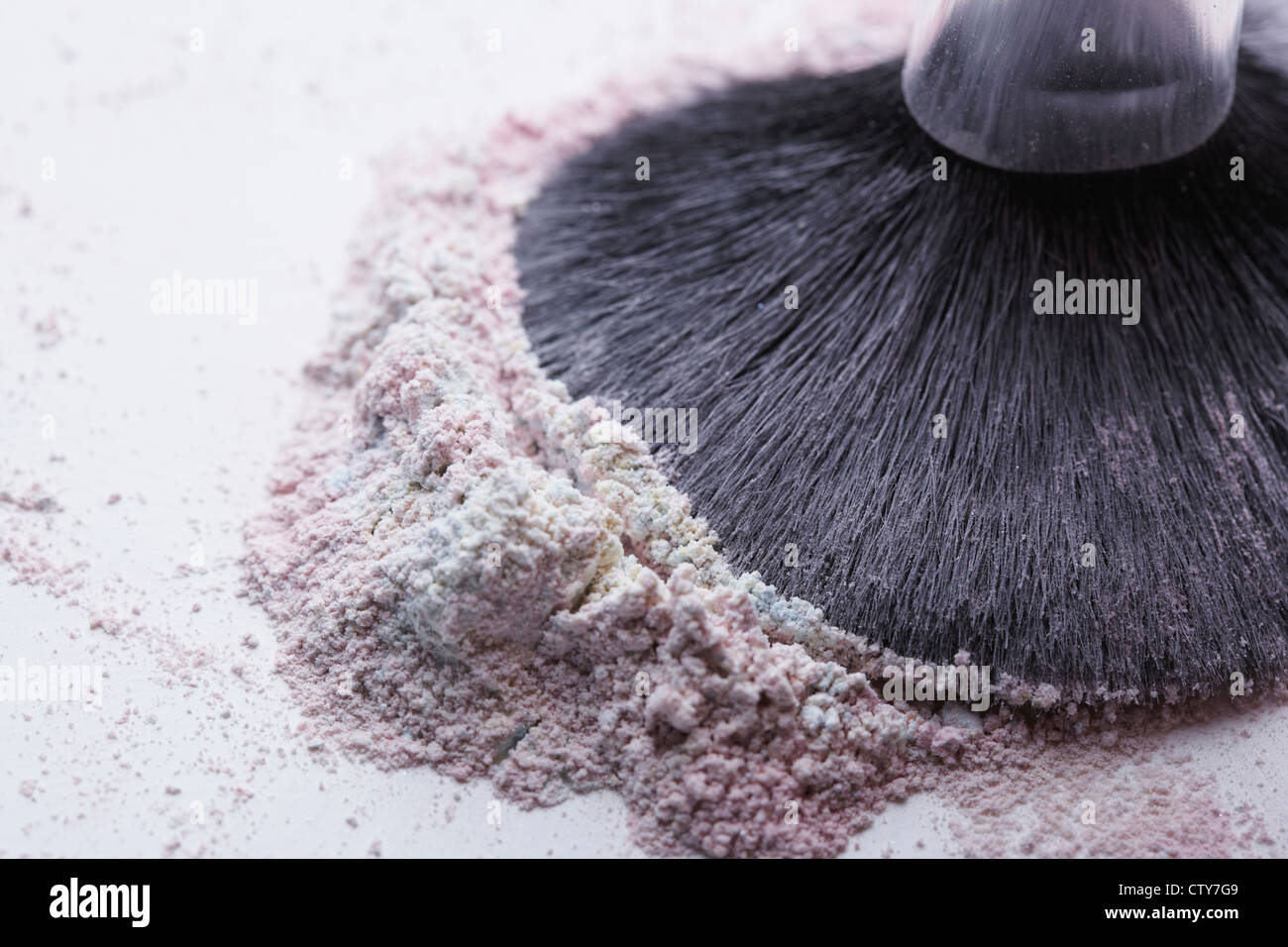 A cosmetic brush with colorful powder Stock Photo - Alamy
