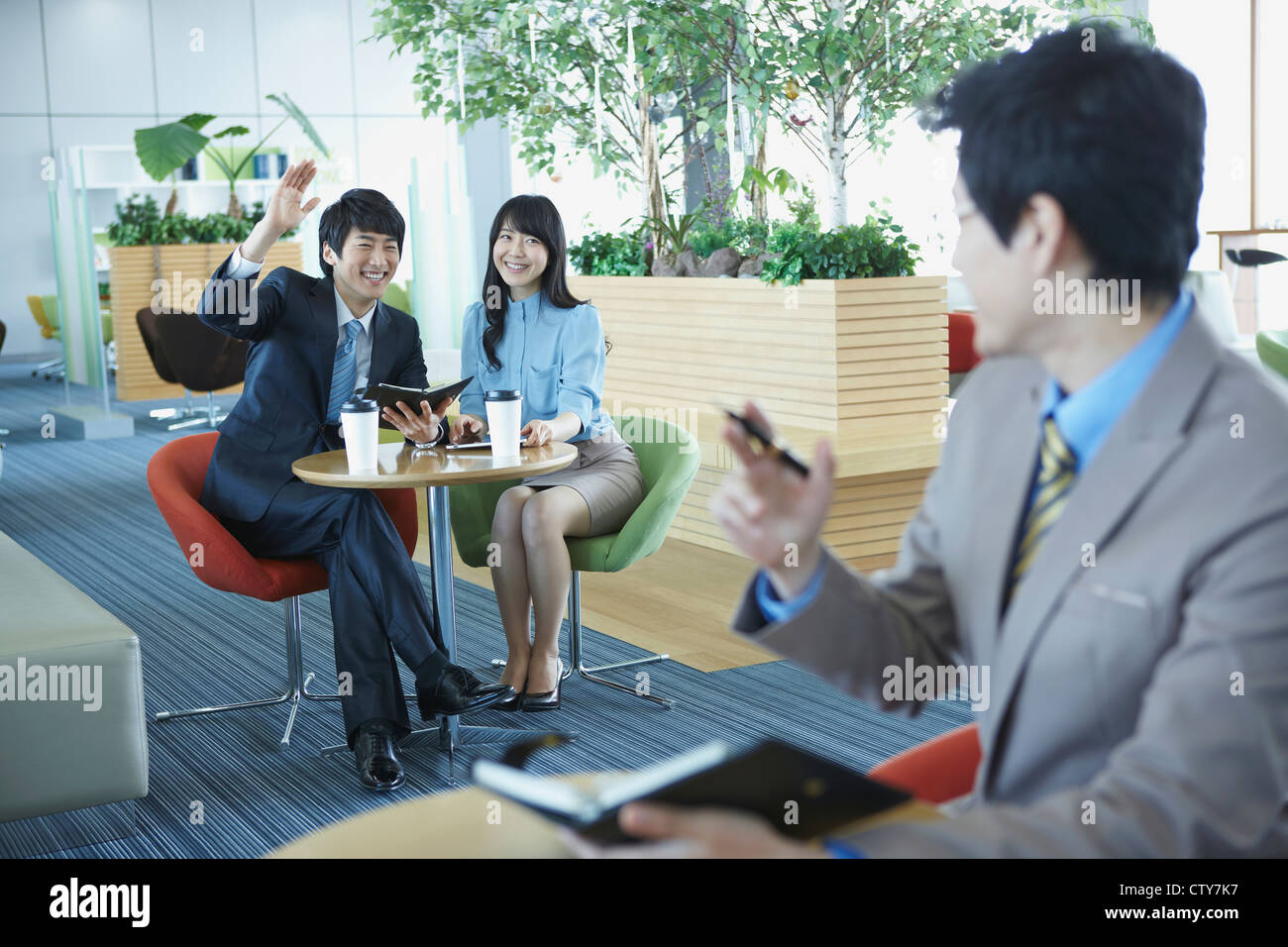 Businessmen saying hello to each other Stock Photo - Alamy