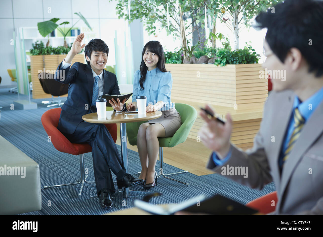 Businessmen saying hello to each other Stock Photo - Alamy