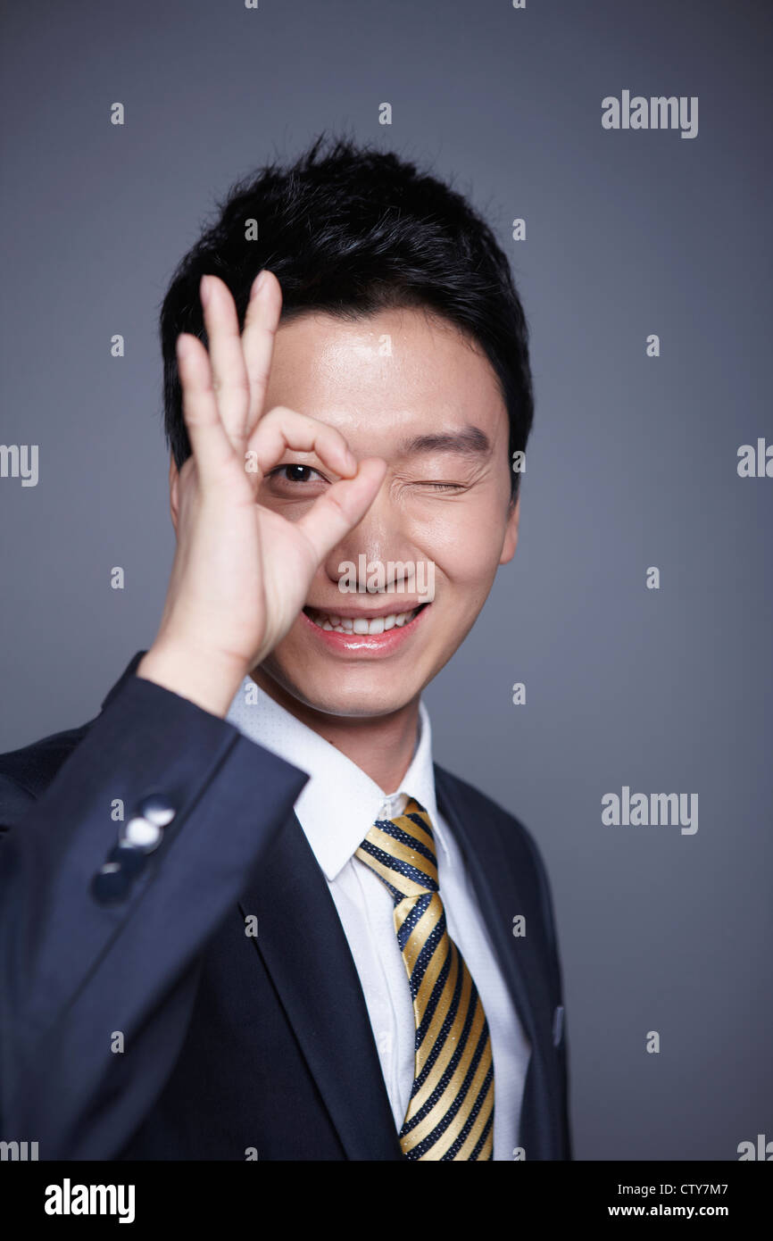 A businessman making OK sign Stock Photo - Alamy