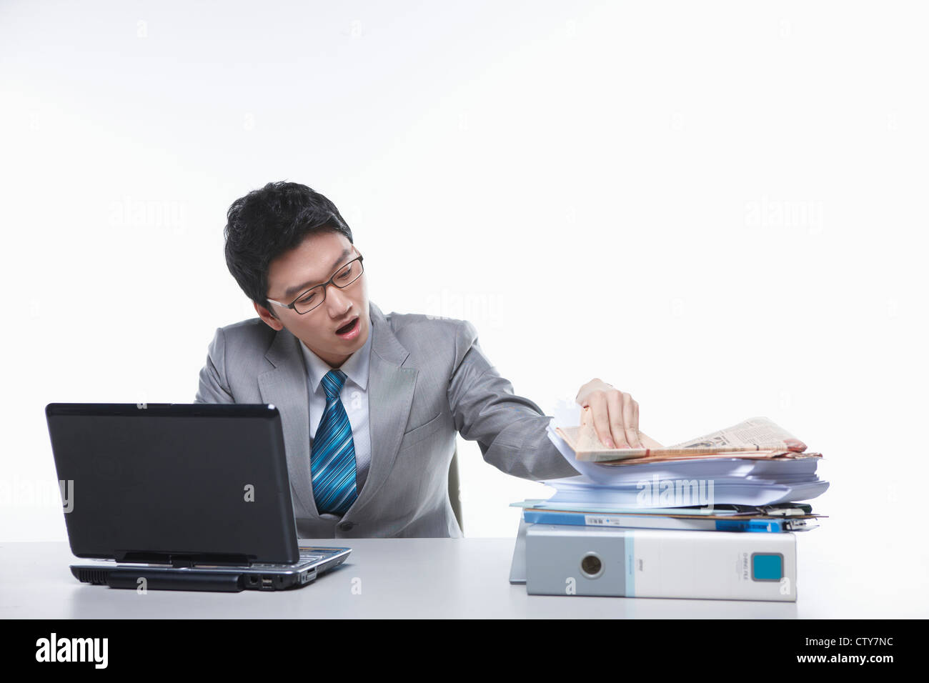 A stressful businessman with the work burden Stock Photo - Alamy