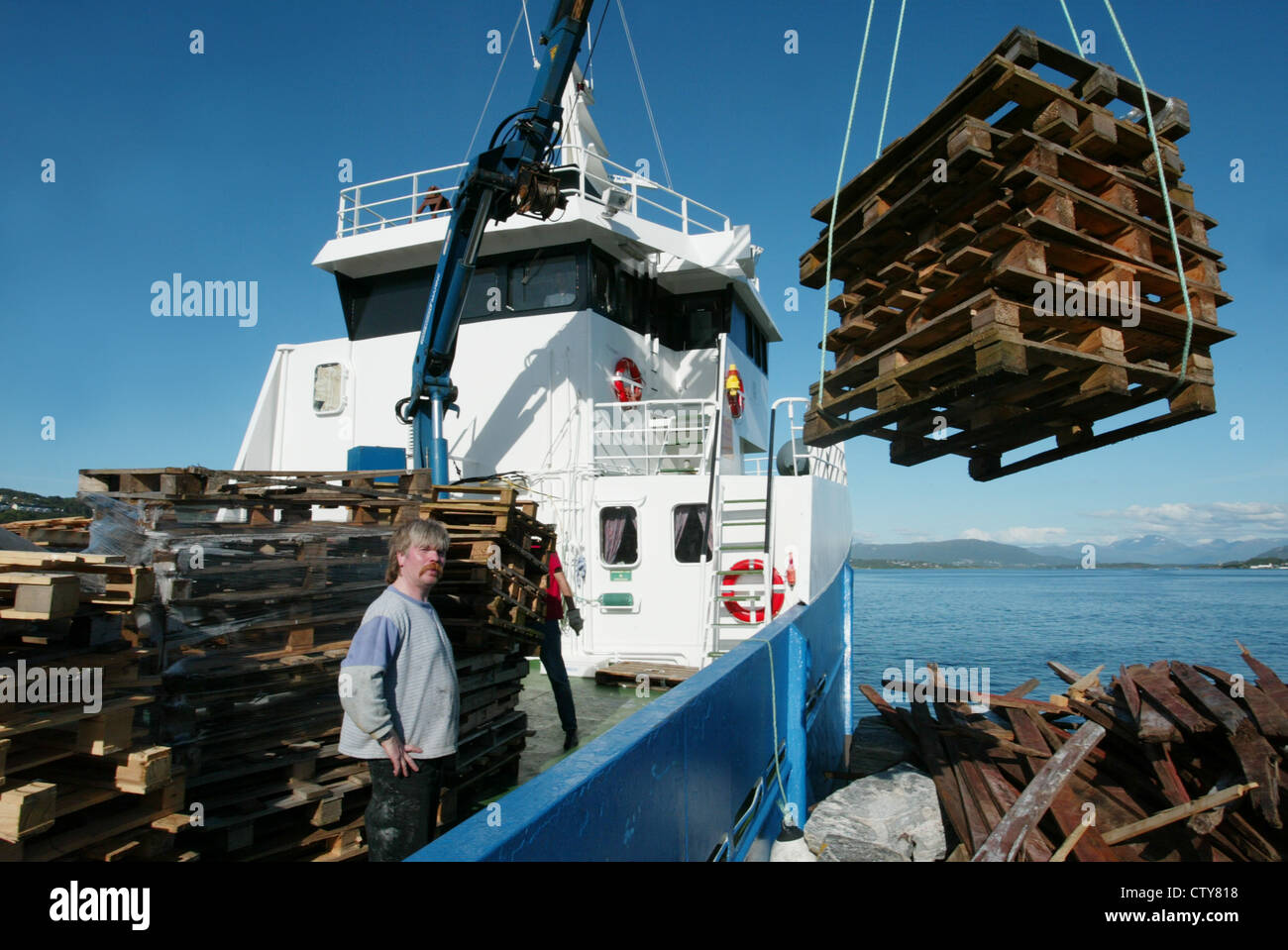 Midsummer Eve bonfire being built out of wooden pallets and crates at ...